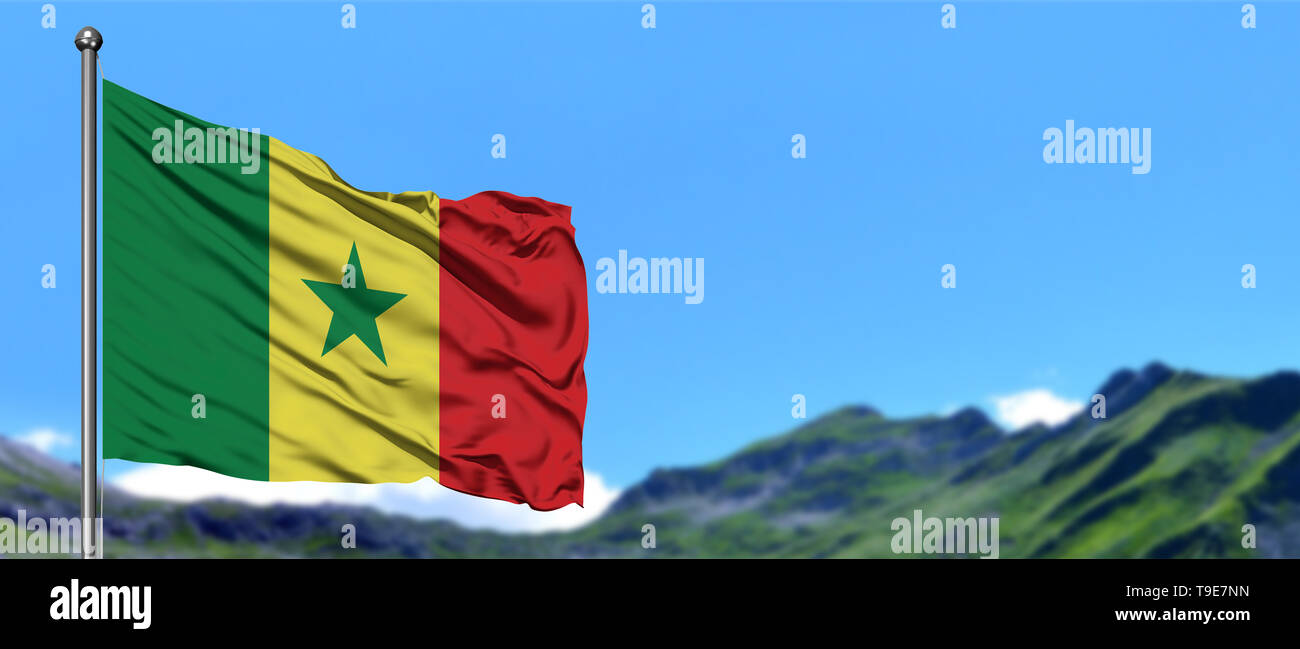 Senegal flag waving in the blue sky with green fields at mountain peak ...