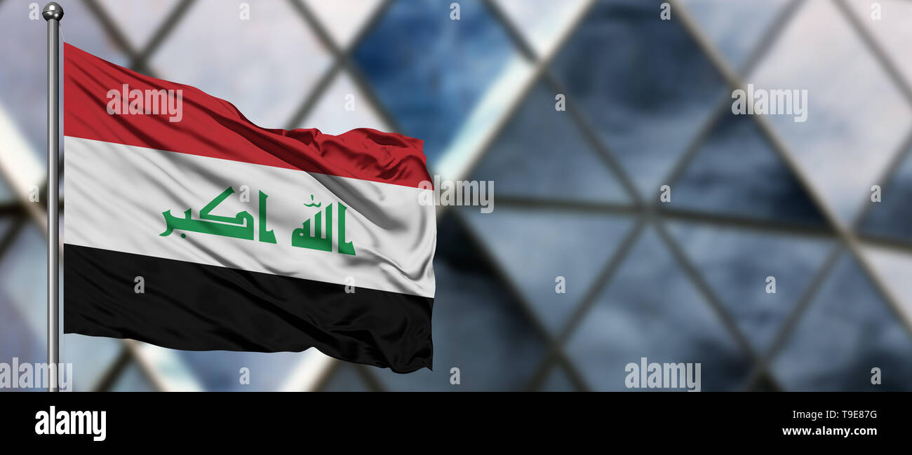 Iraq flag waving in the wind against blurred modern building. Business ...