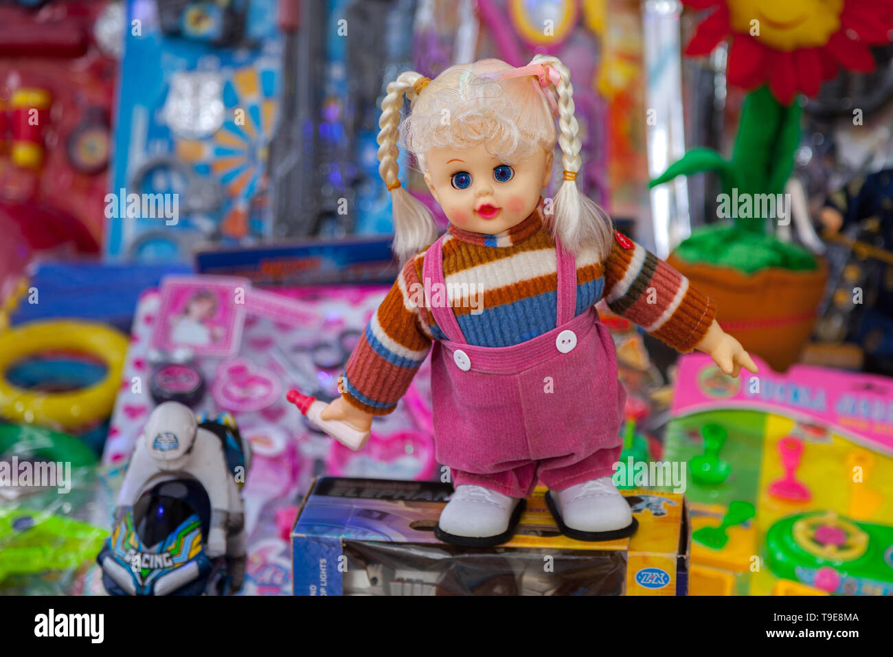 Charming girl with doll hi-res stock photography and images - Alamy