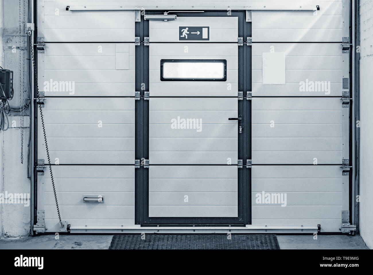 Closed door inside of the long corridor Stock Photo - Alamy