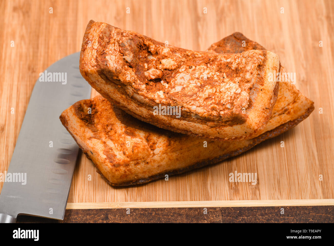 Group of two pieces of traditional Eastern European smoked pork bacon ...