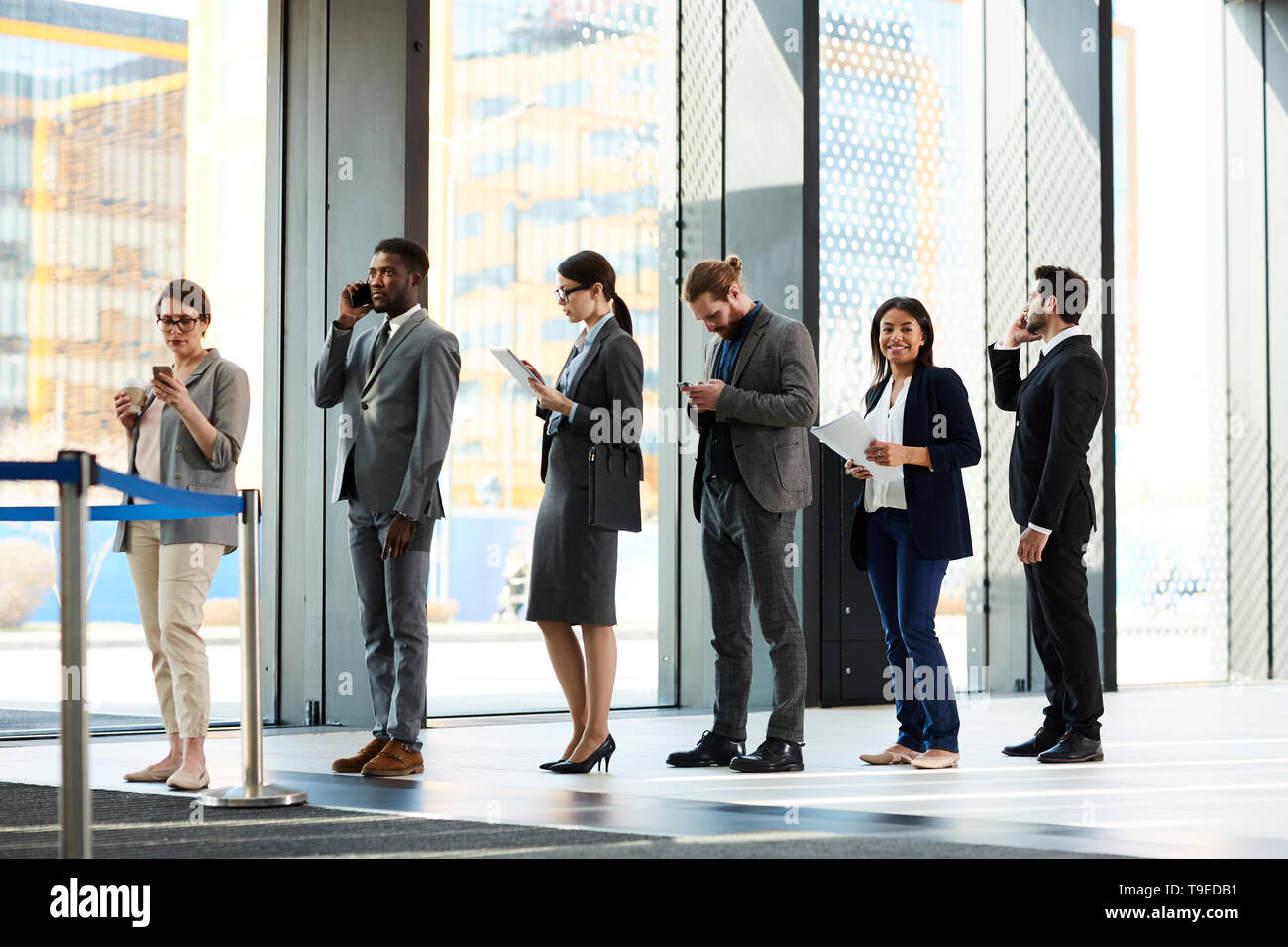 Queue in lounge Stock Photo - Alamy