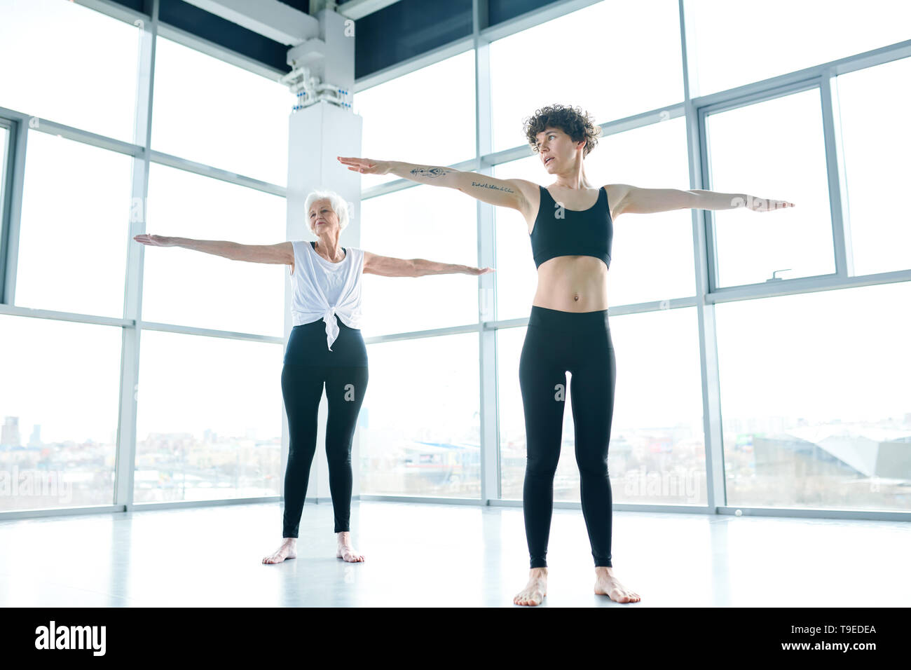 Exercising in large gym Stock Photo - Alamy