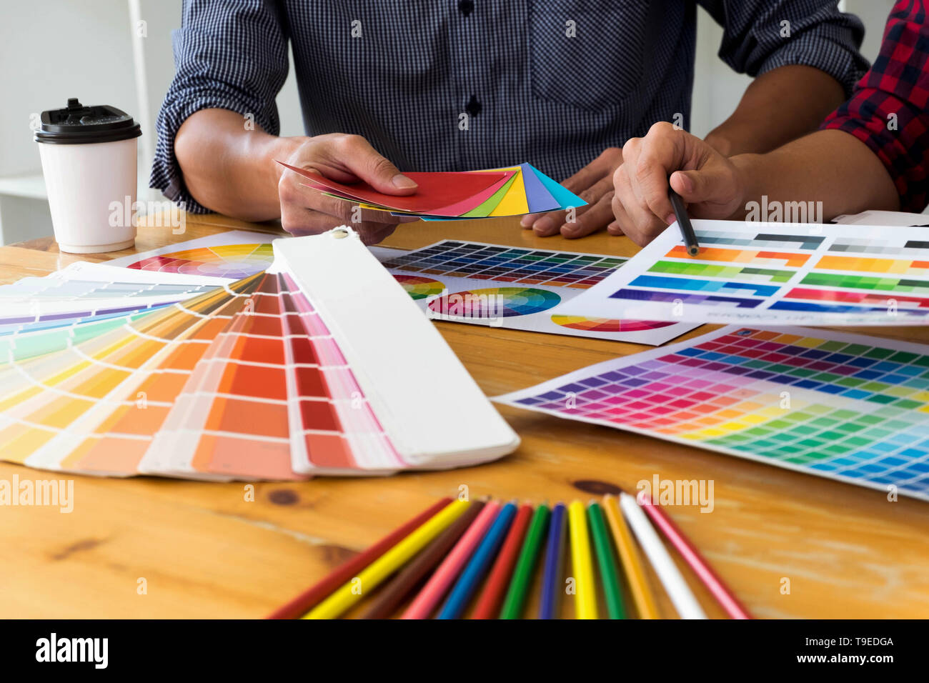 Graphic designers choose colors from the color bands samples for design ...