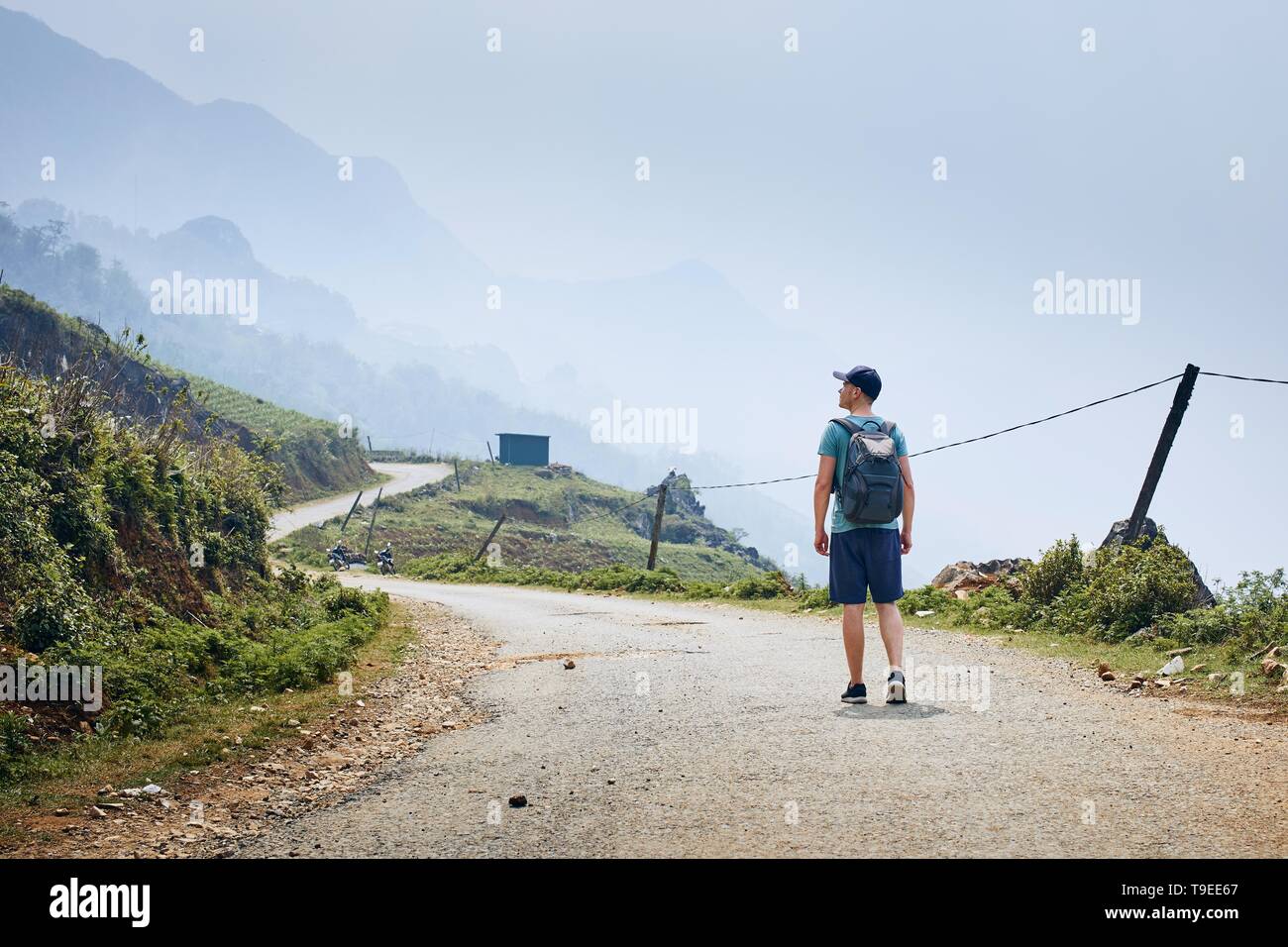 Man walking on winding road hi-res stock photography and images - Alamy