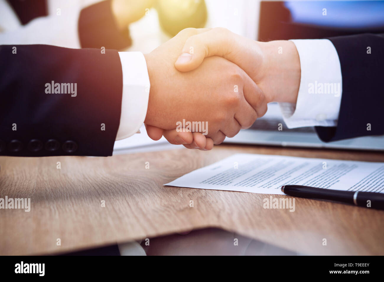 Business people shaking hands at meeting or negotiation in the office ...