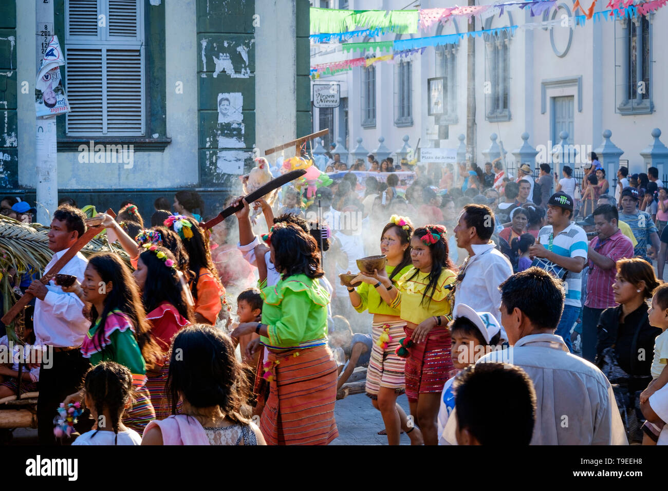 People in disguise dance and celebrate their traditions on the parade ...