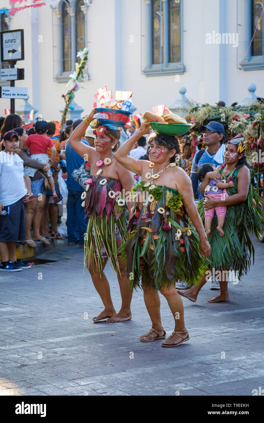 People in disguise dance and celebrate their traditions on the parade ...