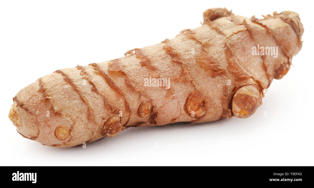 Raw turmeric over white background Stock Photo - Alamy