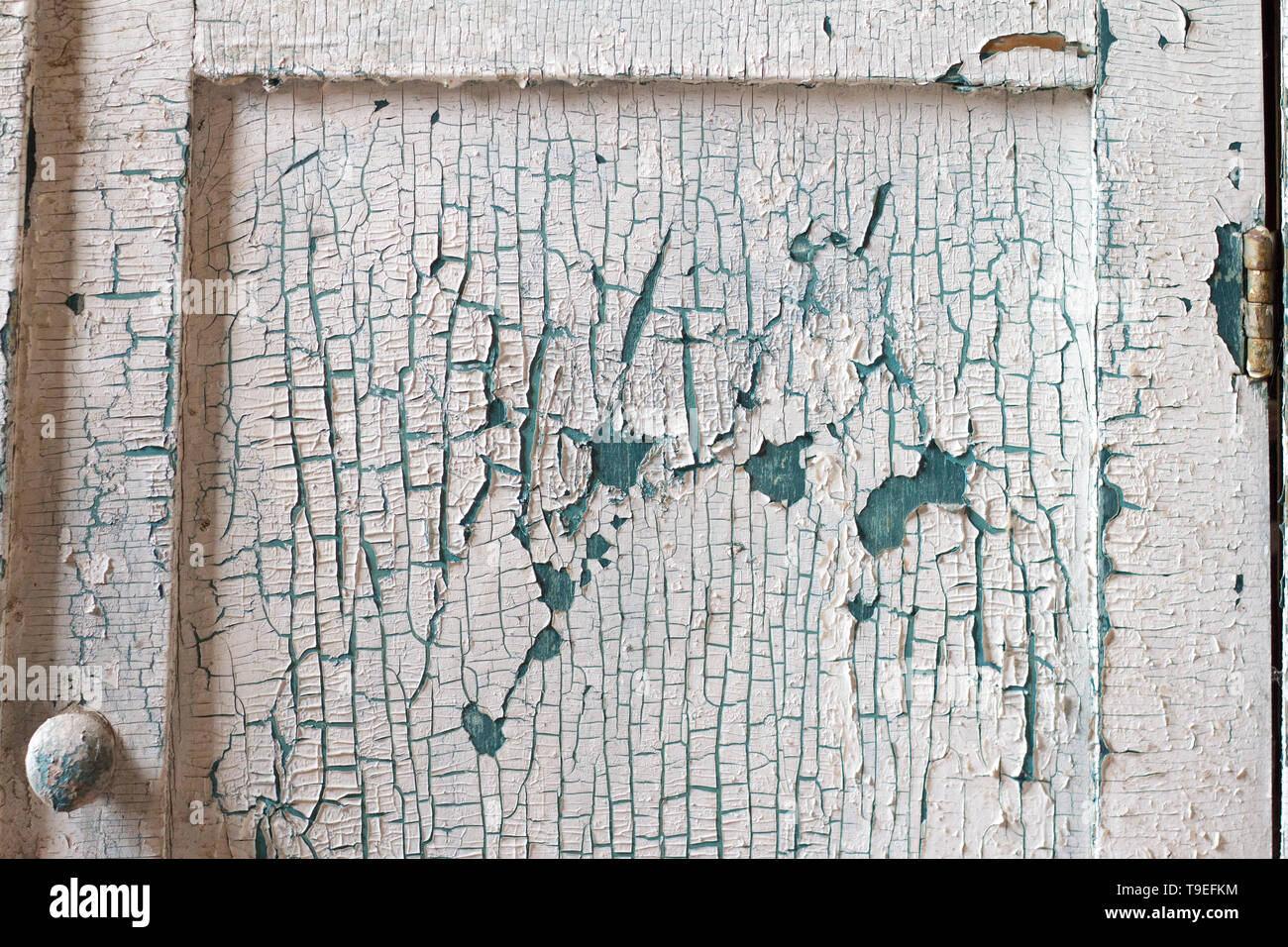 Closeup of old paint on old kitchen cabinets, background or concept ...