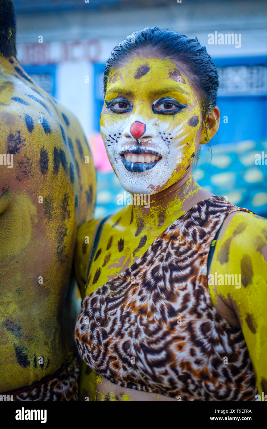 People in disguise dance and celebrate their traditions on the parade ...