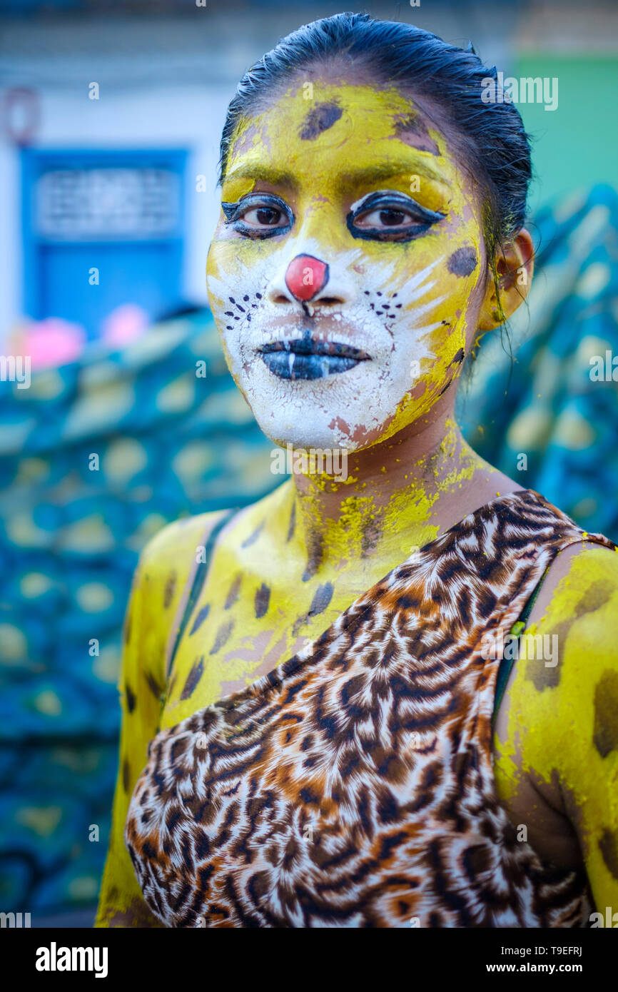 People in disguise dance and celebrate their traditions on the parade ...