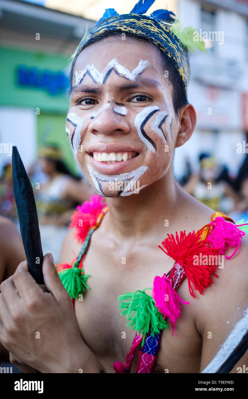 People in disguise dance and celebrate their traditions on the parade ...