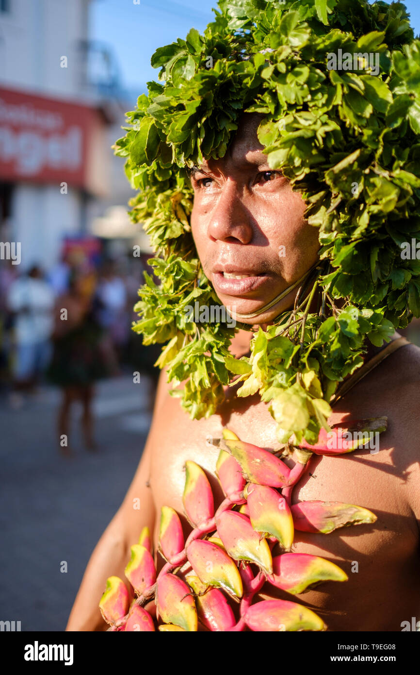 People in disguise dance and celebrate their traditions on the parade ...