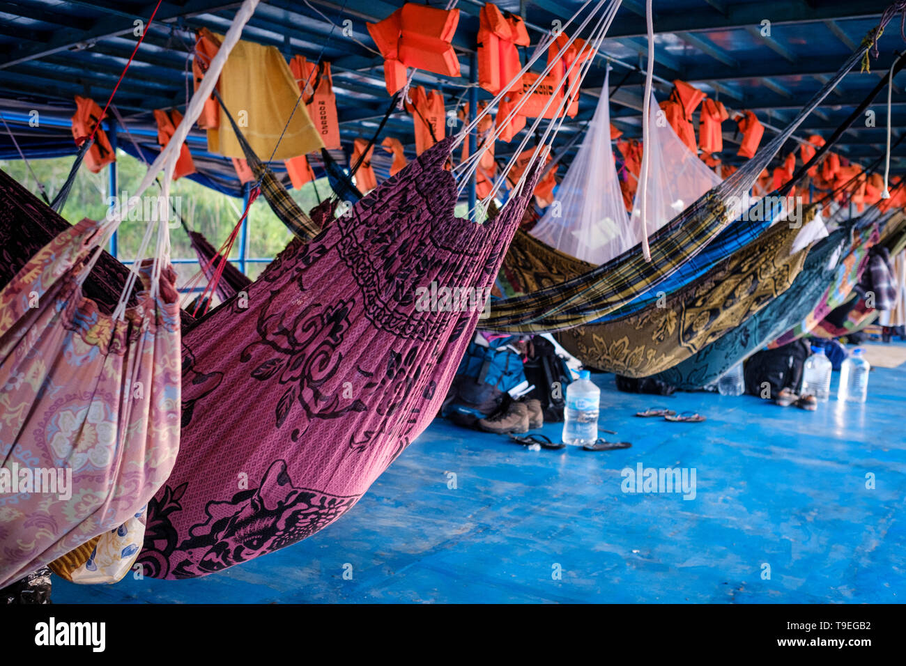 Hammocks for passengers set on the deck of the lancha or ferry that ...