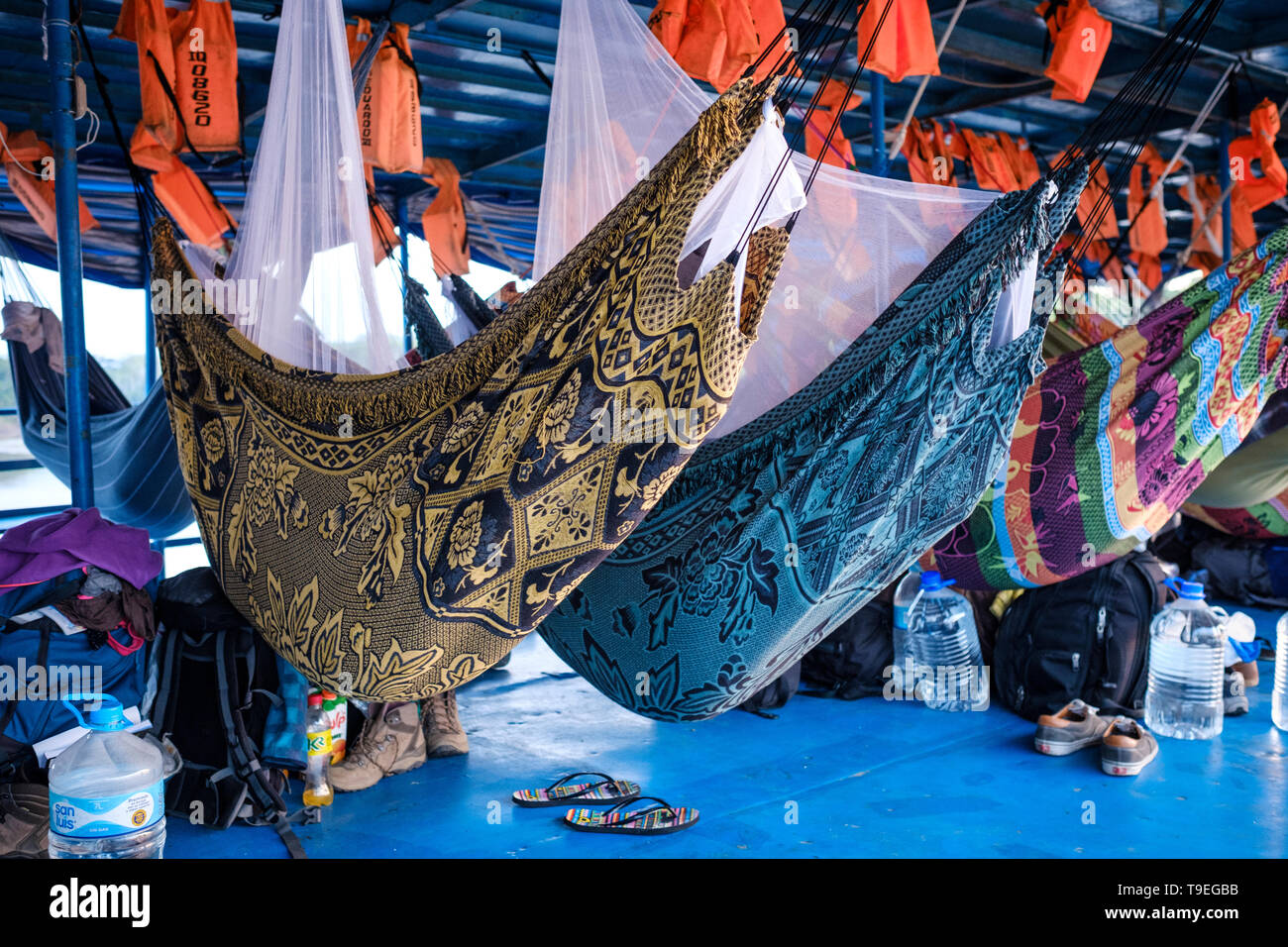 Hammocks for passengers set on the deck of the lancha or ferry that ...