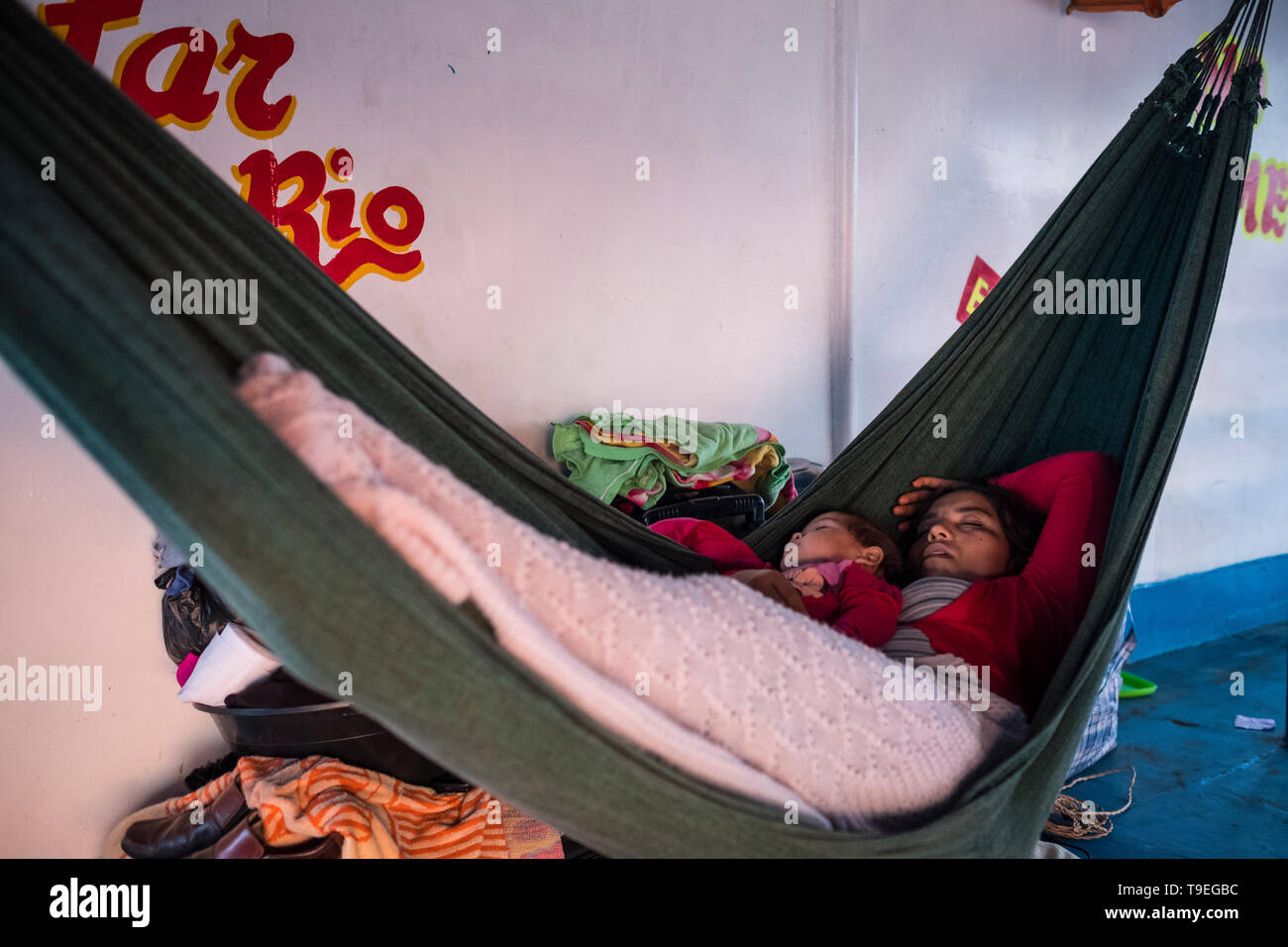 Hammocks for passengers set on the deck of the lancha or ferry that ...
