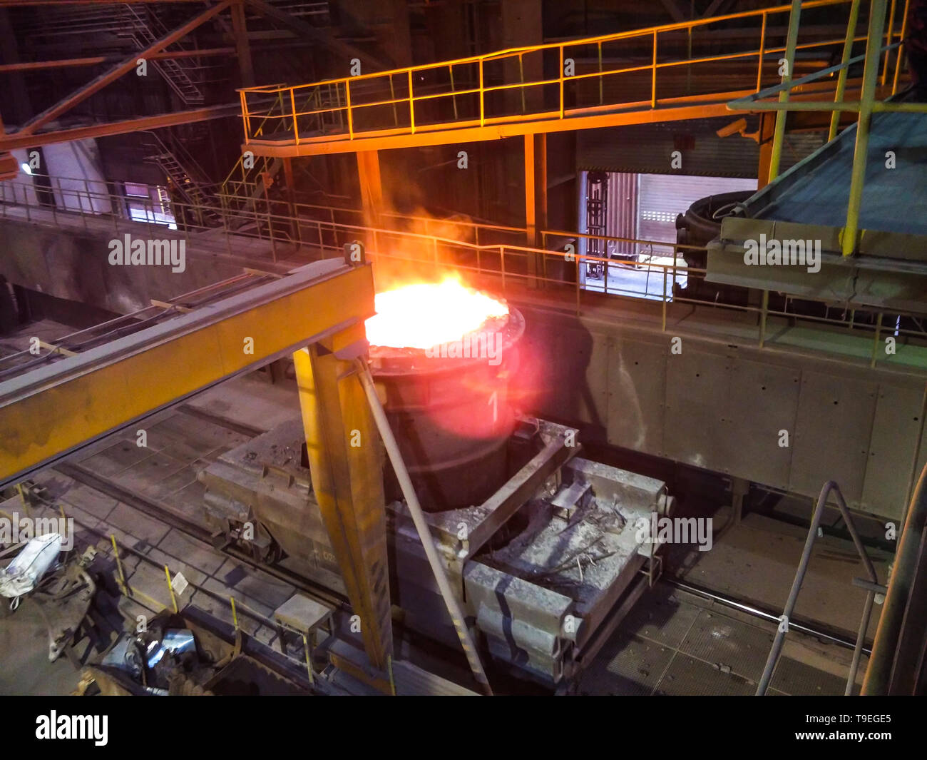 Smelting of metal in big foundry. Iron and steel production at a ...