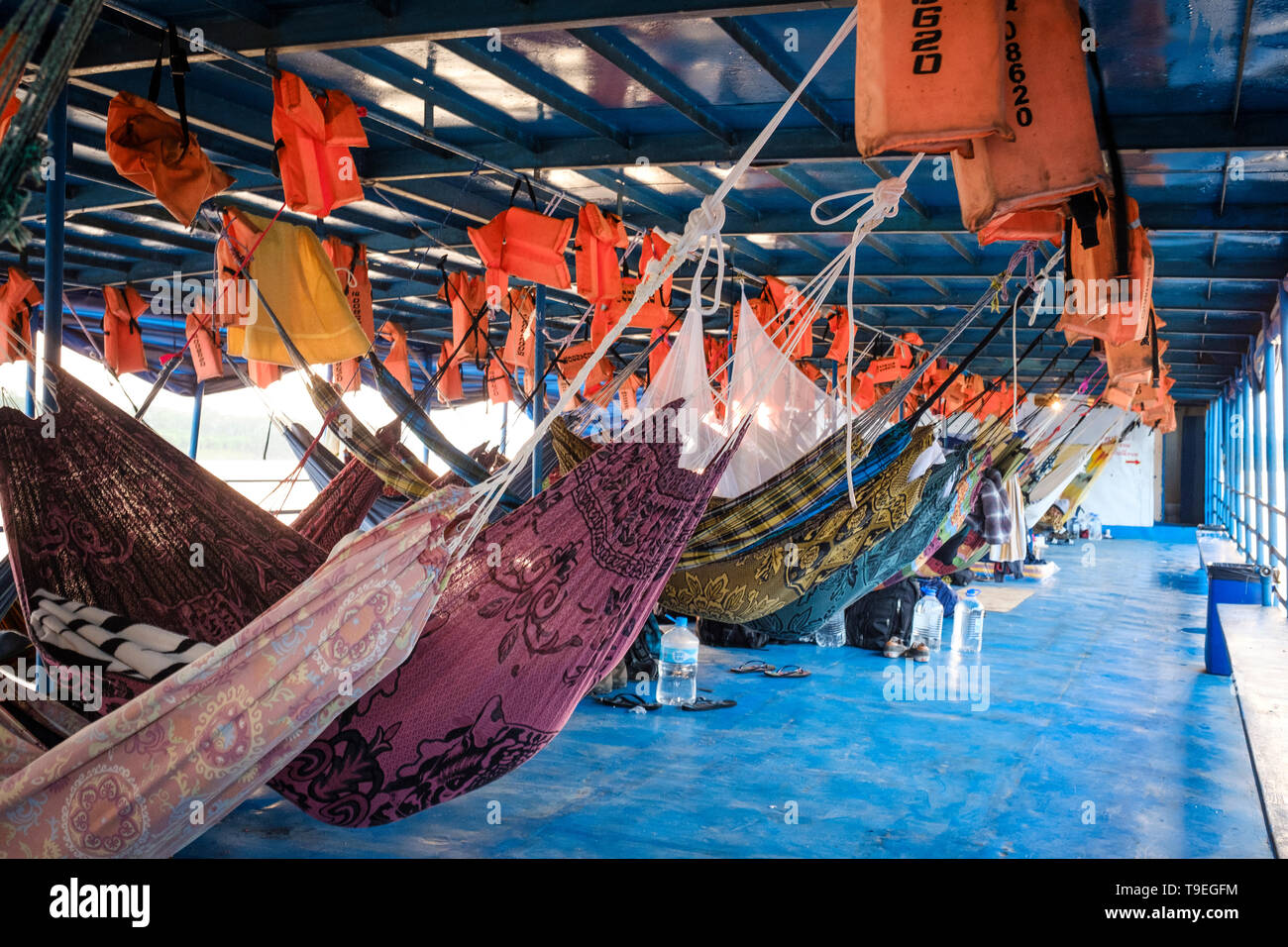 Hammocks for passengers set on the deck of the lancha or ferry that ...