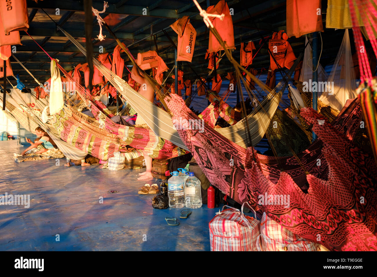 Hammocks for passengers set on the deck of the lancha or ferry that ...