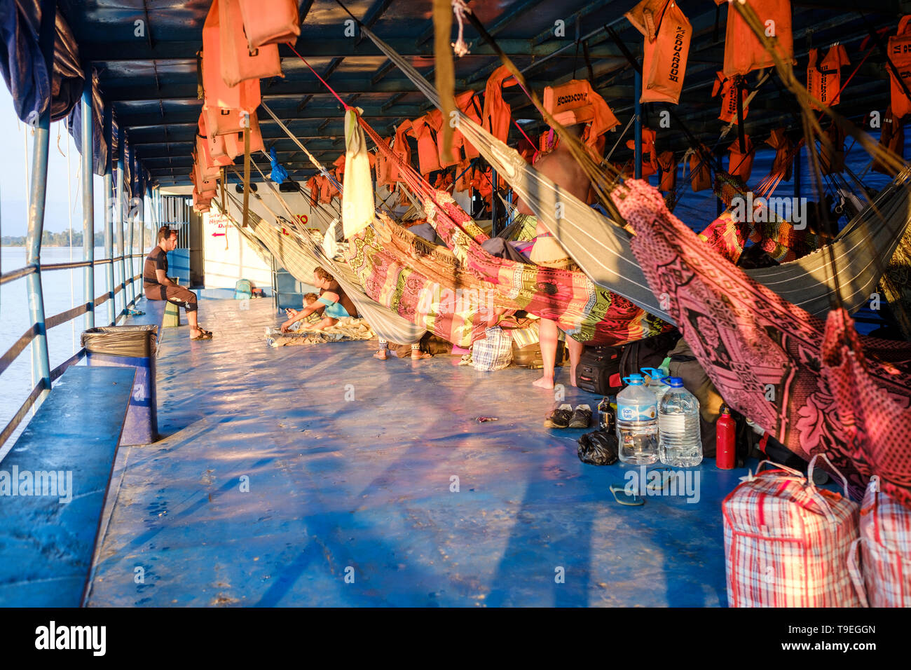 Hammocks for passengers set on the deck of the lancha or ferry that ...
