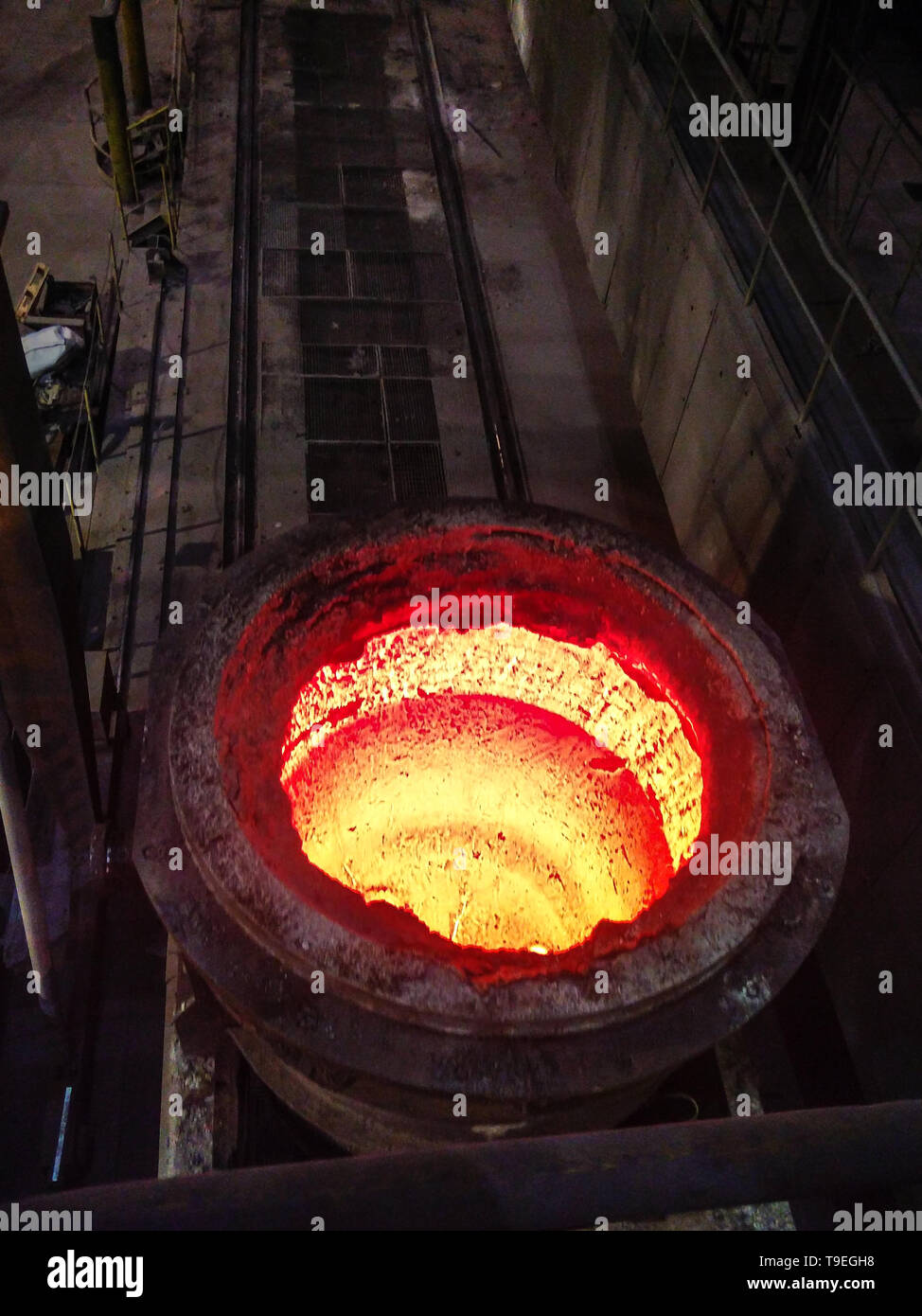 Smelting of metal in big foundry. Iron and steel production at a ...