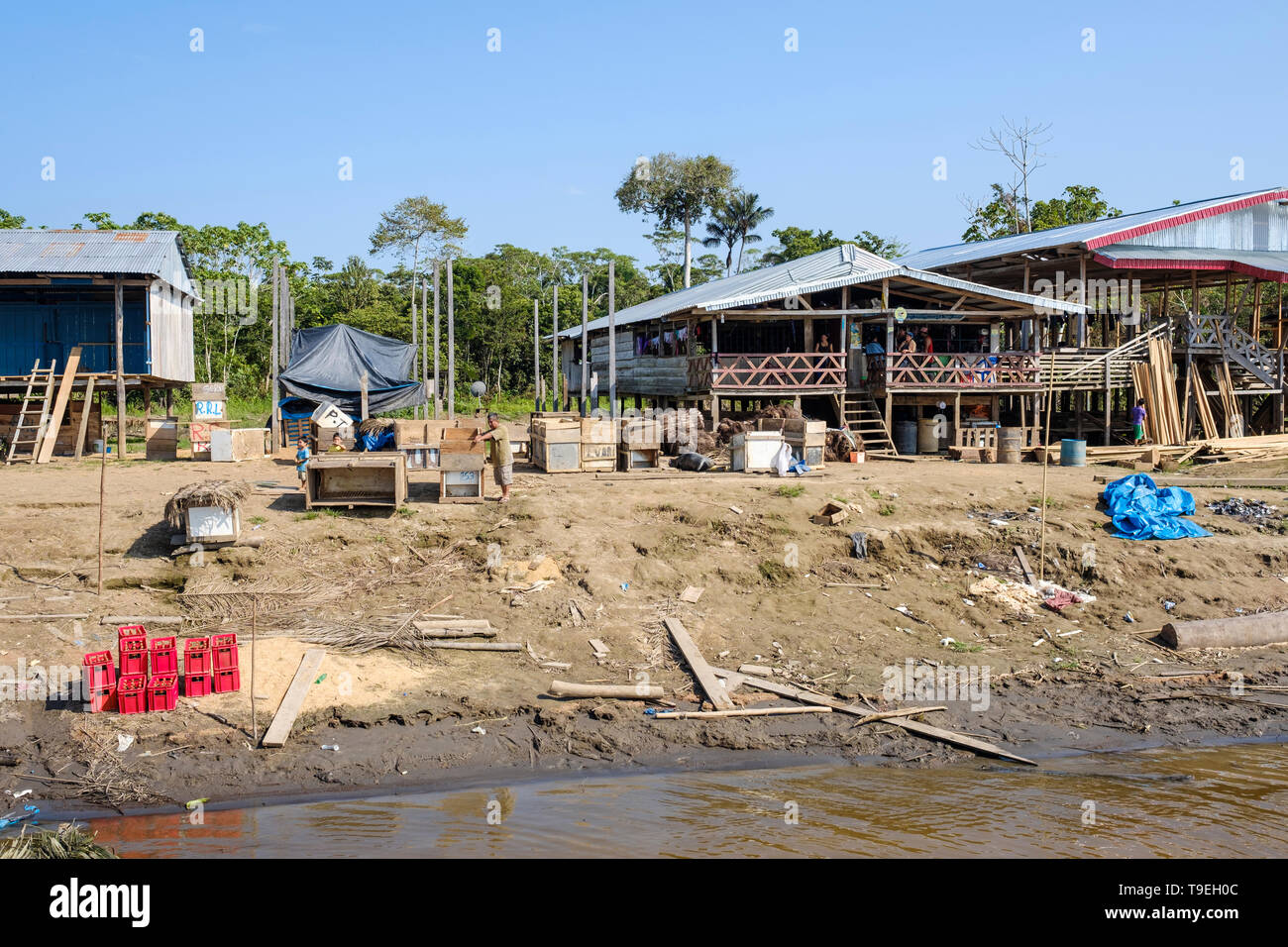 Community on the riverbank seen on the ferry Yurimaguas-Iquitos line ...