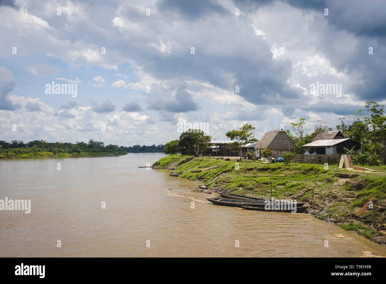 Community on the riverbank seen on the ferry Yurimaguas-Iquitos line ...