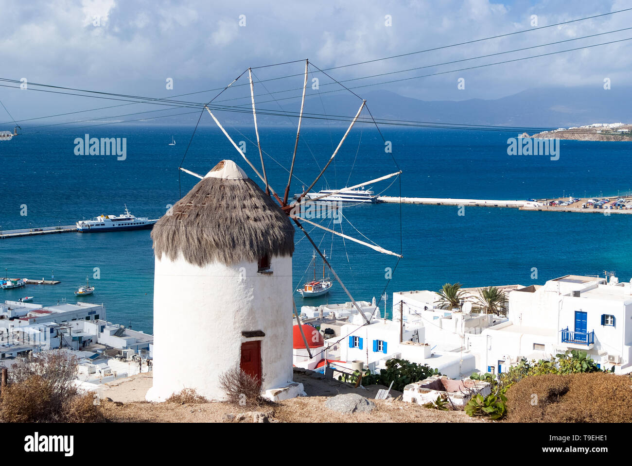 Windmill on seascape in Mykonos, Greece. Windmill on mountain by sea on ...