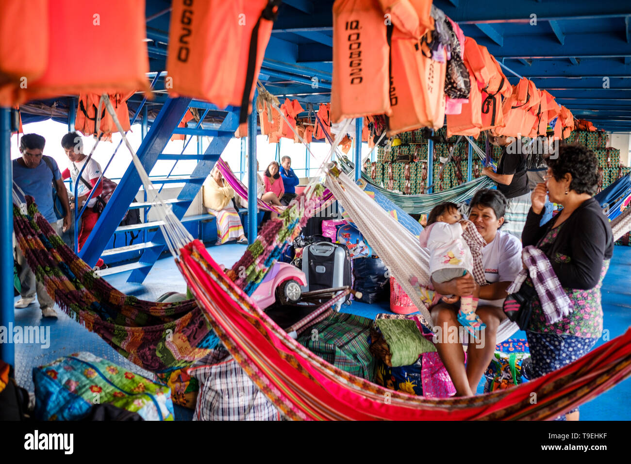 Hammocks for passengers set on the deck of the lancha or ferry that ...