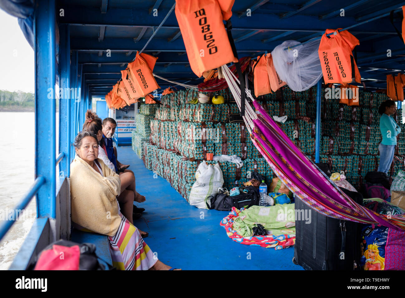Hammocks for passengers set on the deck of the lancha or ferry that ...