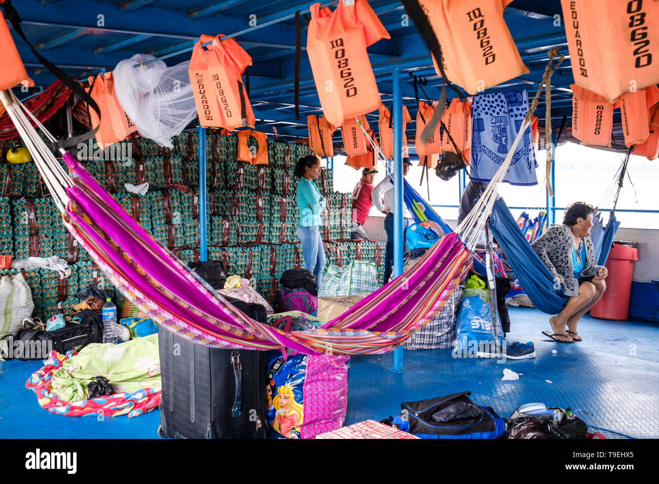 Hammocks for passengers set on the deck of the lancha or ferry that ...