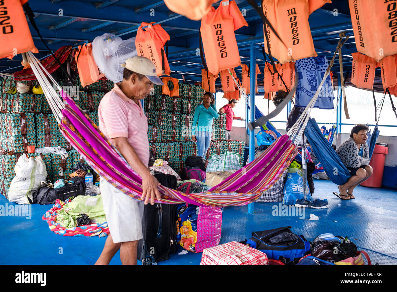 Hammocks for passengers set on the deck of the lancha or ferry that ...