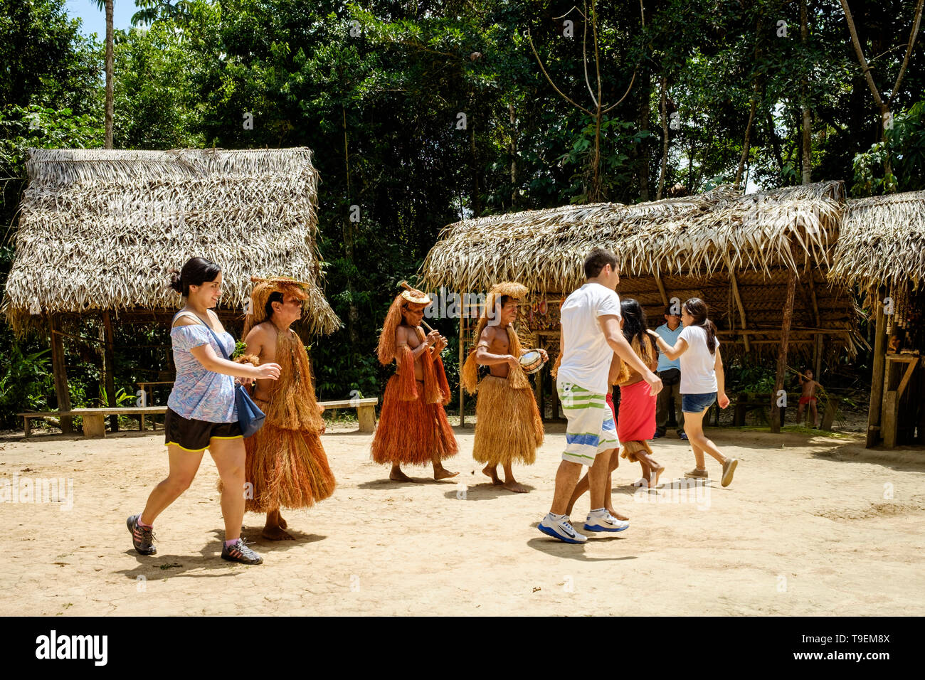 Group of tourists dancing with Yagua tribe members on the Yagua village ...