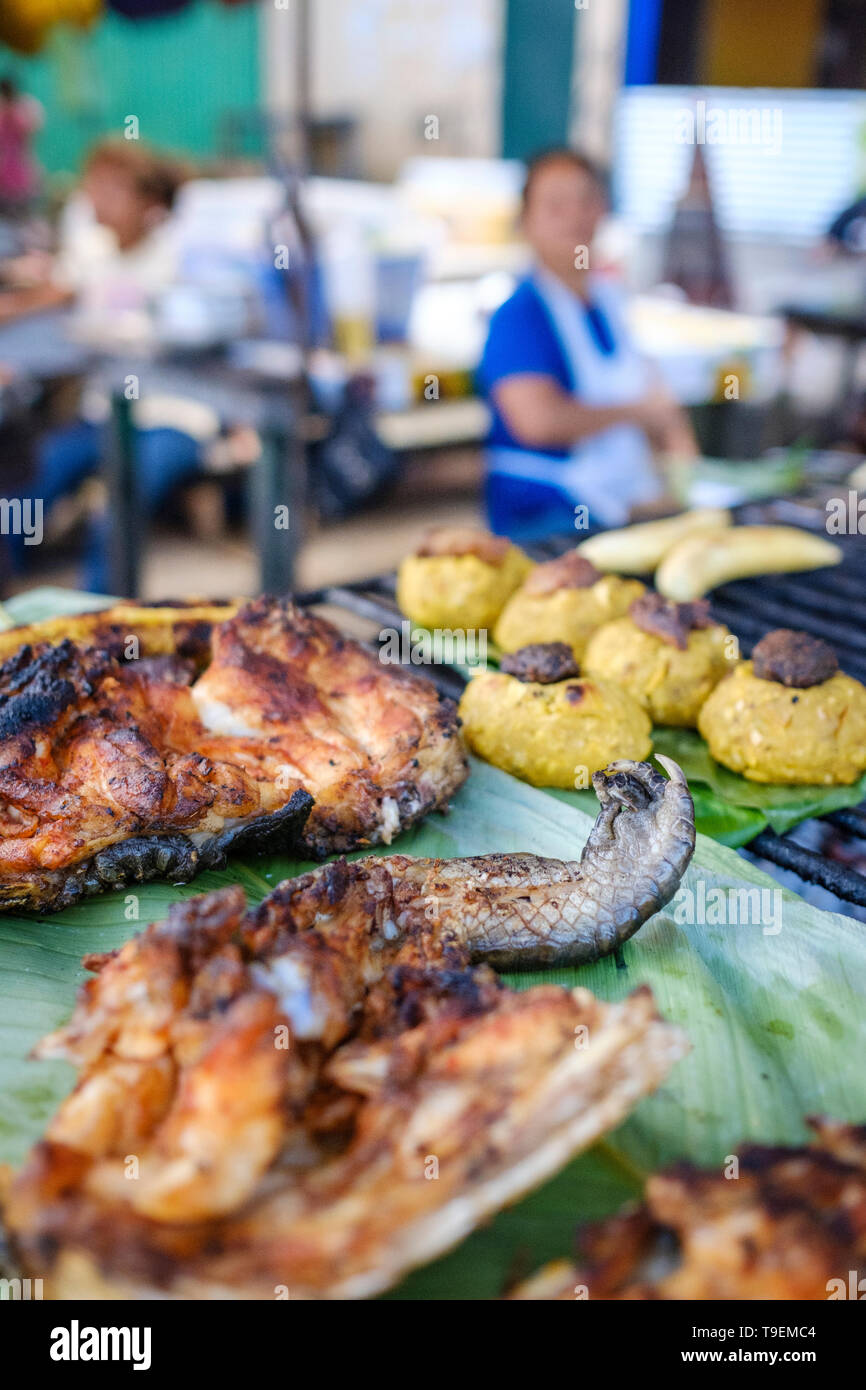 Lizard ready to eat on the menu of an eatery at Bellavista Nanay River ...