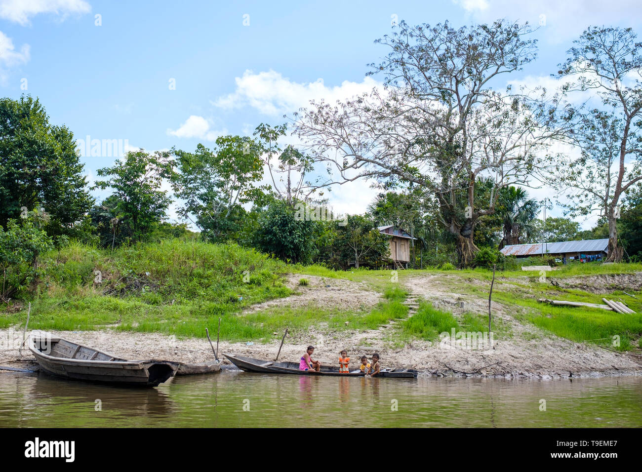 Children playing on the riverbank of the Peruvian Amazon River on ...