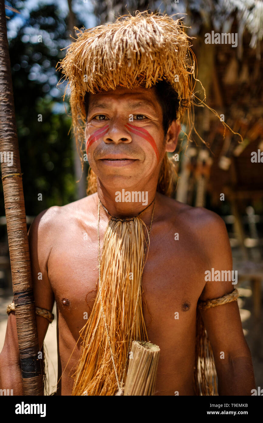Portrait of a Yagua tribe male member holding a blowpipe (or pucuna) on ...