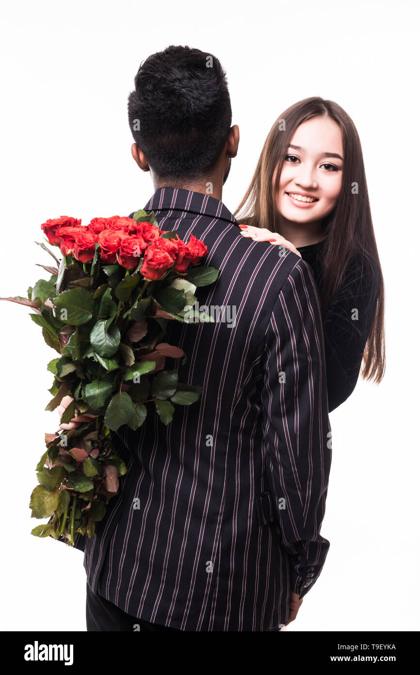 side view of young couple with roses kissing isolated on white Stock ...