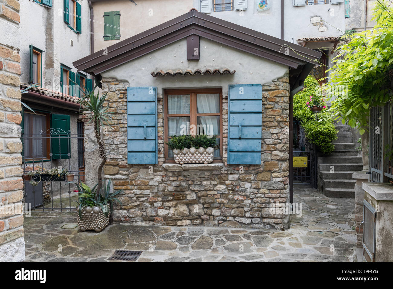 Stone house in the historic centre of Grado, Italy Stock Photo - Alamy