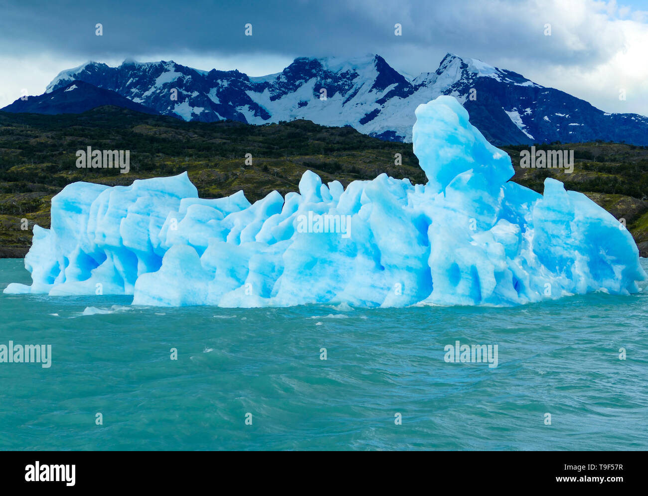 A strange heavenly iceberg floating in Argentino Lake in the Patagonian ...