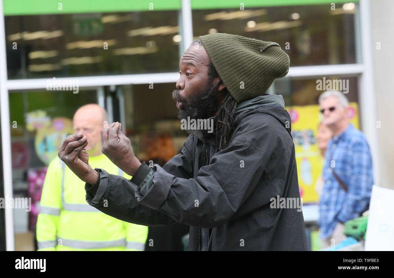 Manchester, UK, 18th May, 2019. A homeless guy challenging a street ...