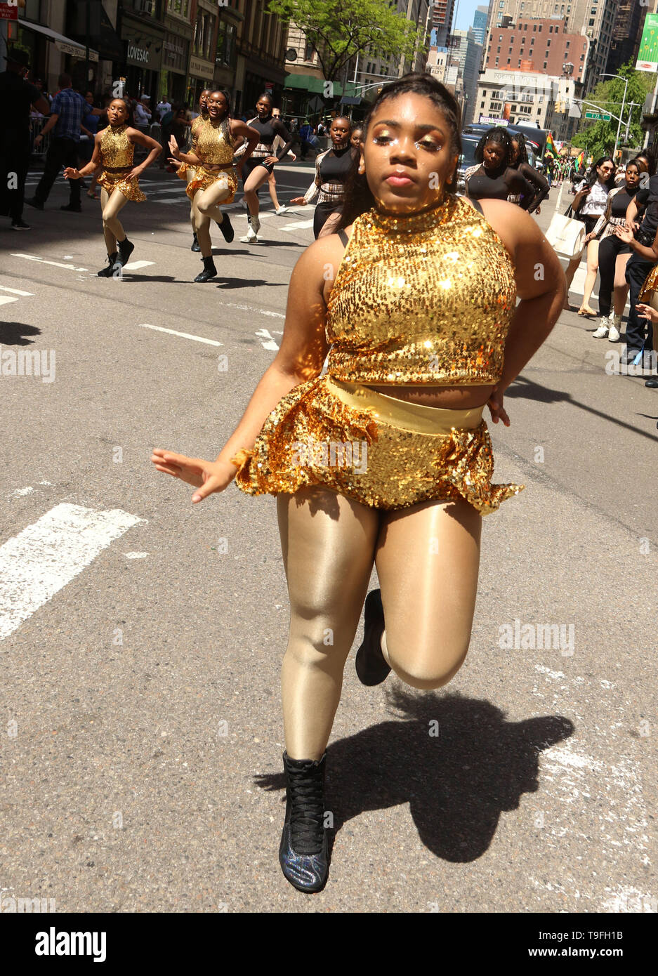 New York, USA. 18th May, 2019. Parade goers display their dance moves ...
