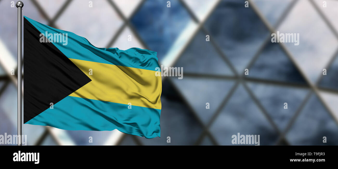Bahamas flag waving in the wind against blurred modern building ...