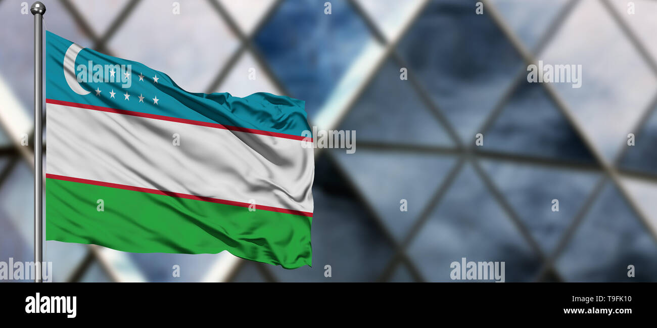 Uzbekistan flag waving in the wind against blurred modern building ...