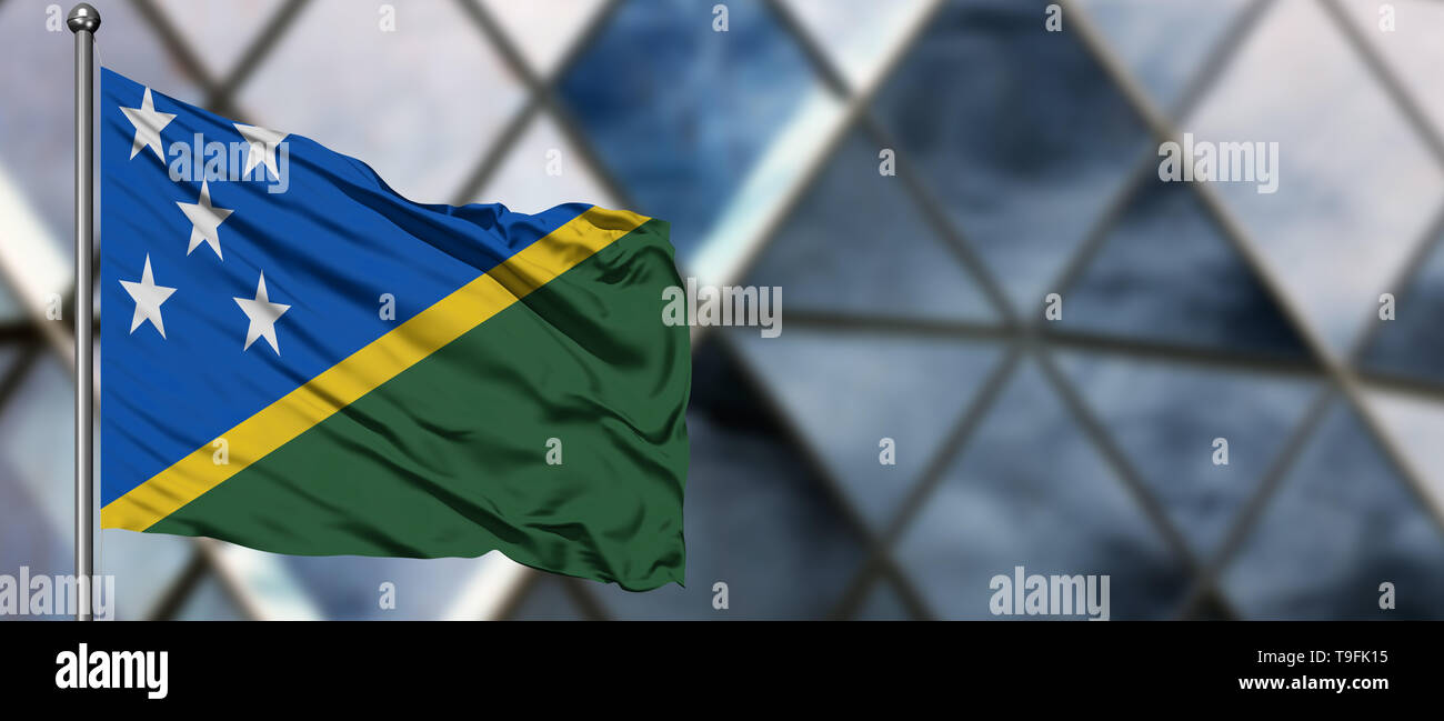 Solomon Islands flag waving in the wind against blurred modern building ...