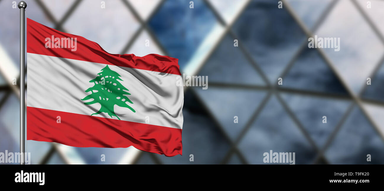 Lebanon flag waving in the wind against blurred modern building ...