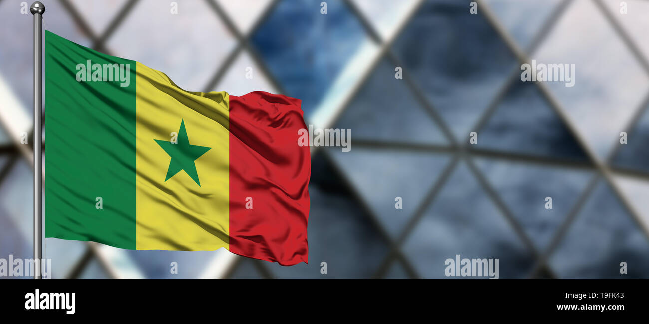 Senegal flag waving in the wind against blurred modern building ...