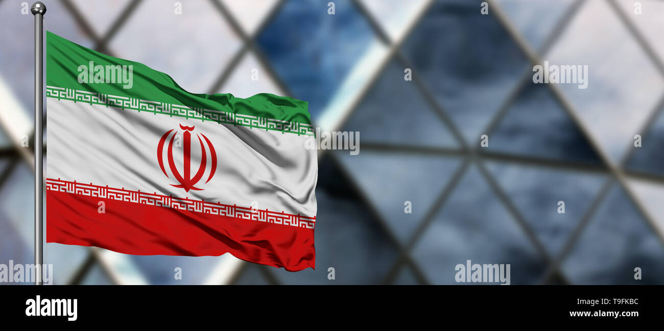 Iran flag waving in the wind against blurred modern building. Business ...