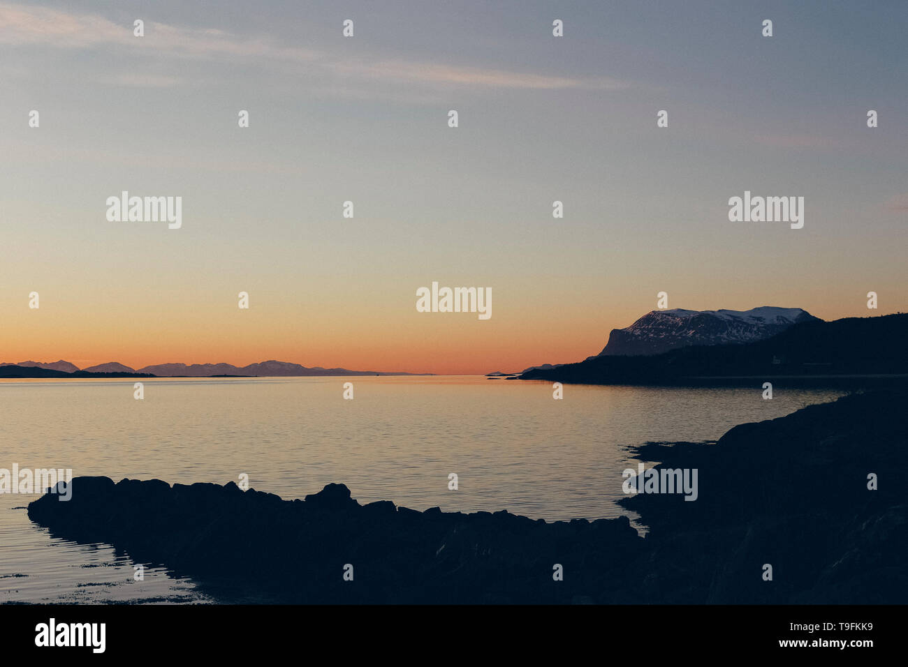 Sunset in the Norwegian North Sea, midnight sun, film grain added Stock ...