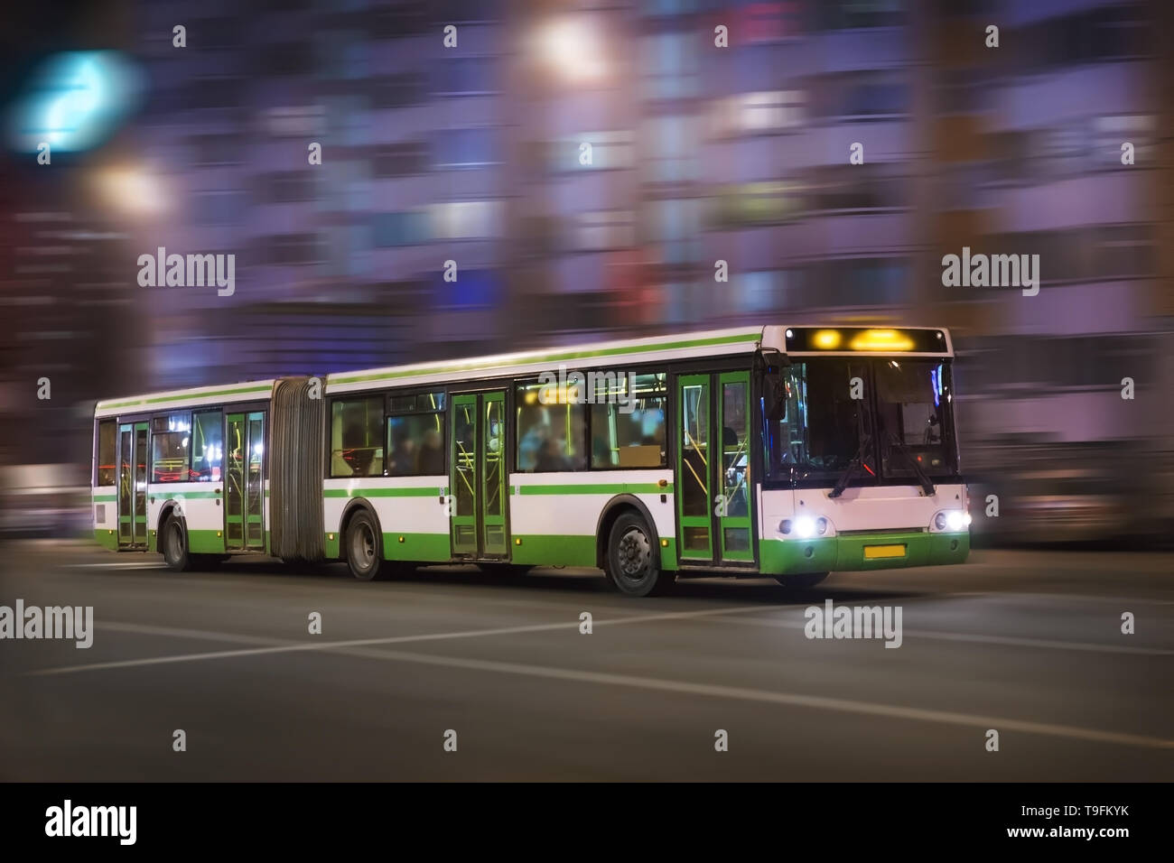 bus moves on city street at night Stock Photo - Alamy